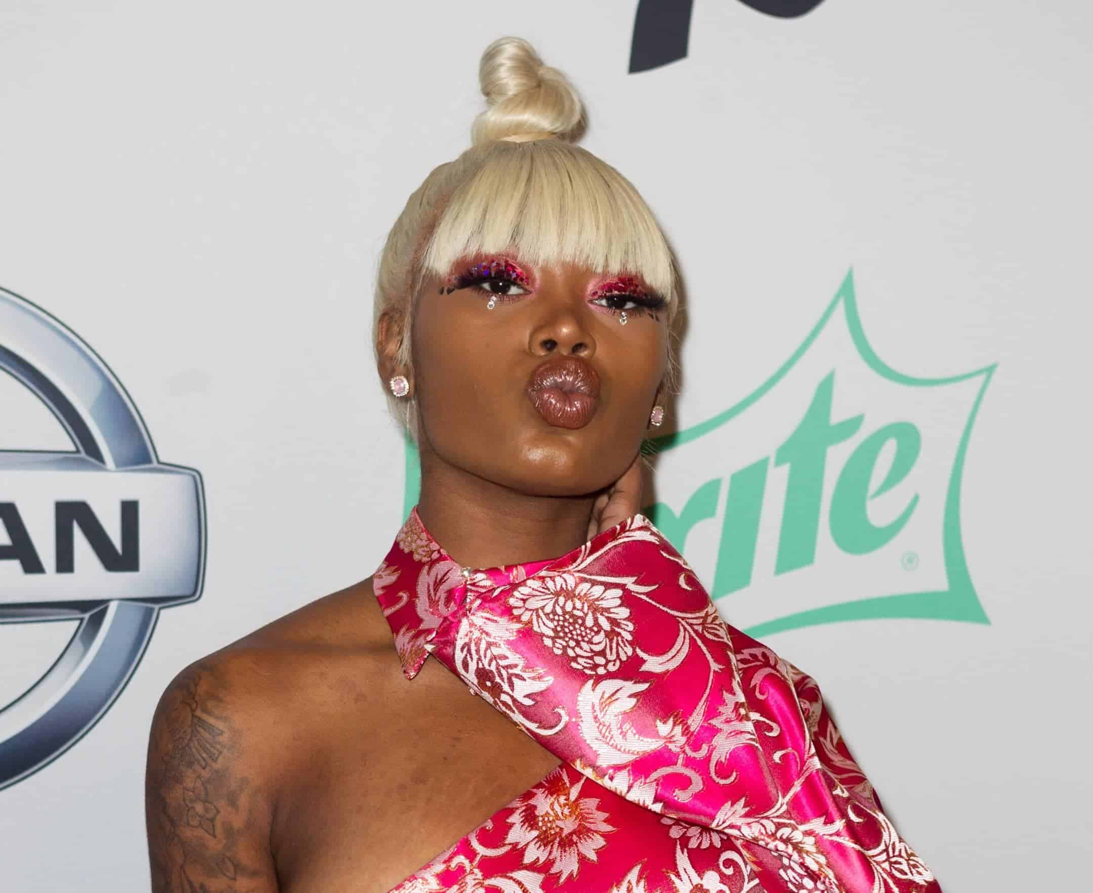 Asian Doll Claps Back At A Fan Who Criticized How Many King Von Tattoos She Has